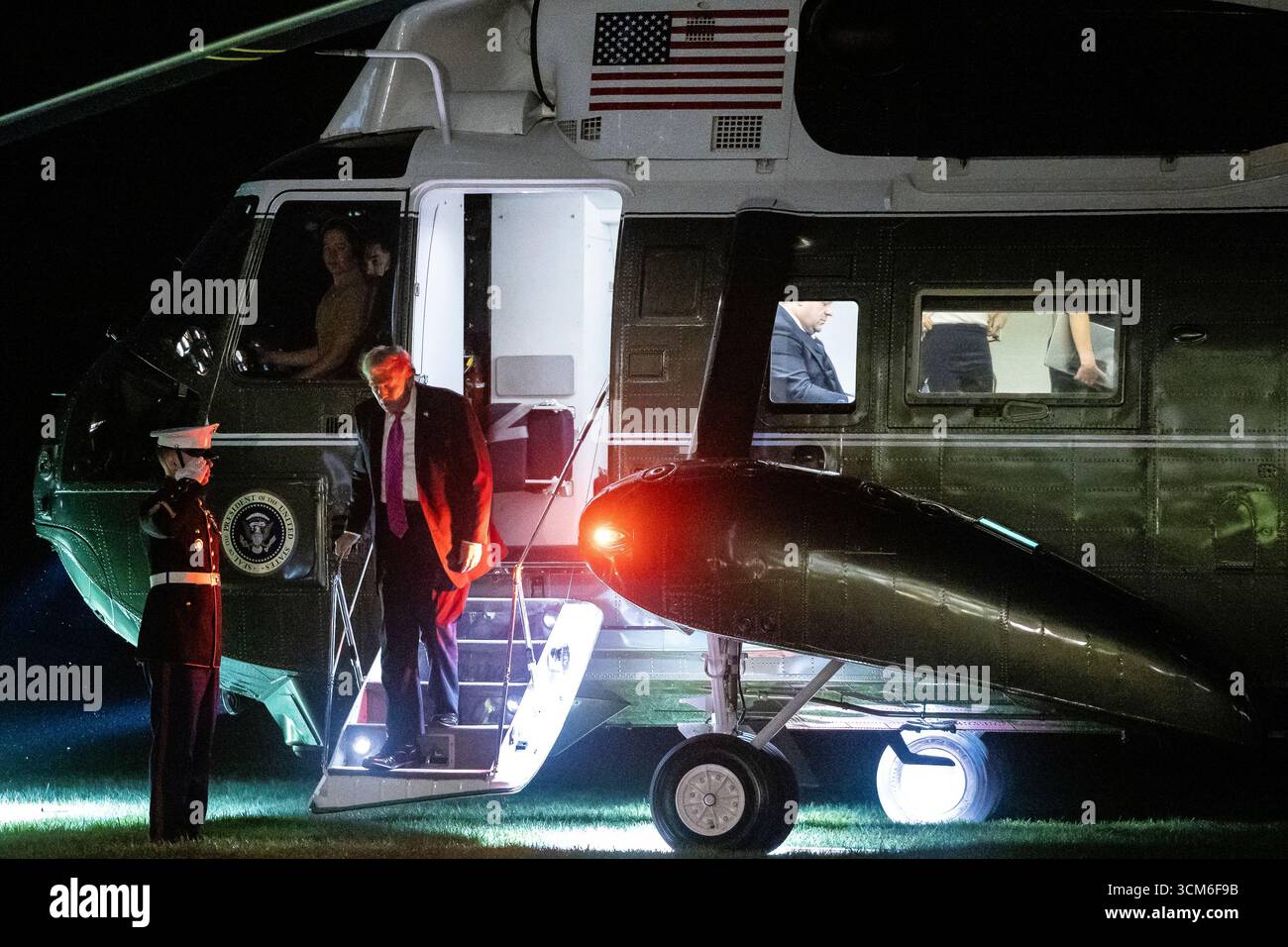 President Donald Trump disembarks from Marine One as he arrives on the ...
