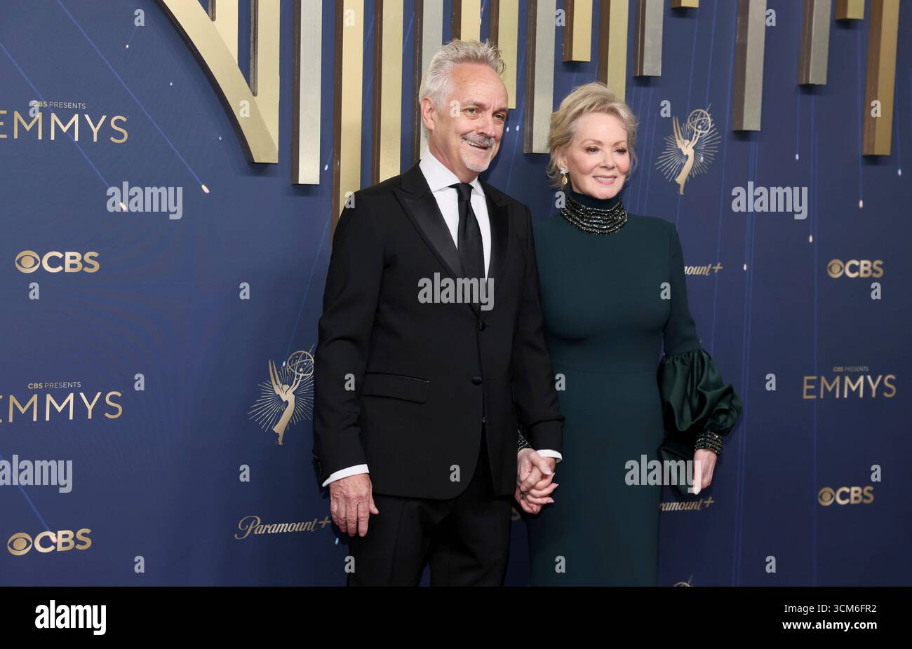 Joe Pacheco, left, and Jean Smart arrive at the 77th Emmy Awards on ...