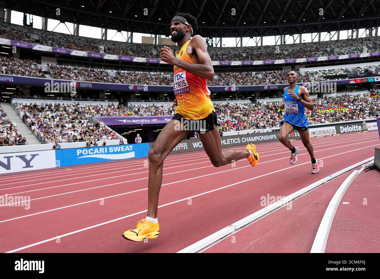 Germany's Amanal Petros, left, leads Tanzania's Alphonce Felix Simbu in ...