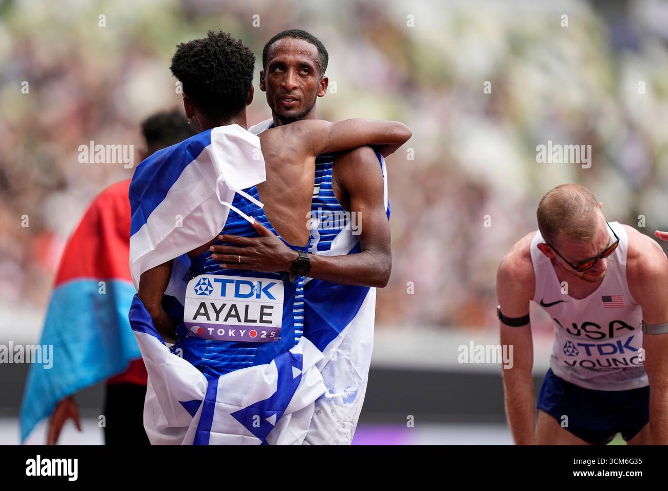 Israel's Haimro Alame embraces Israel's Gashau Ayale after the men's ...