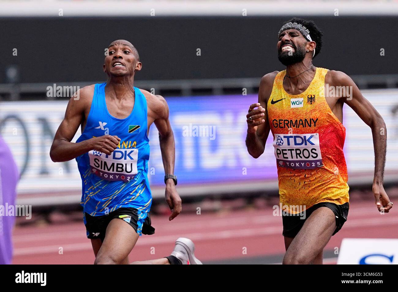Tanzania's Alphonce Felix Simbu, left, and Germany's Amanal Petros ...