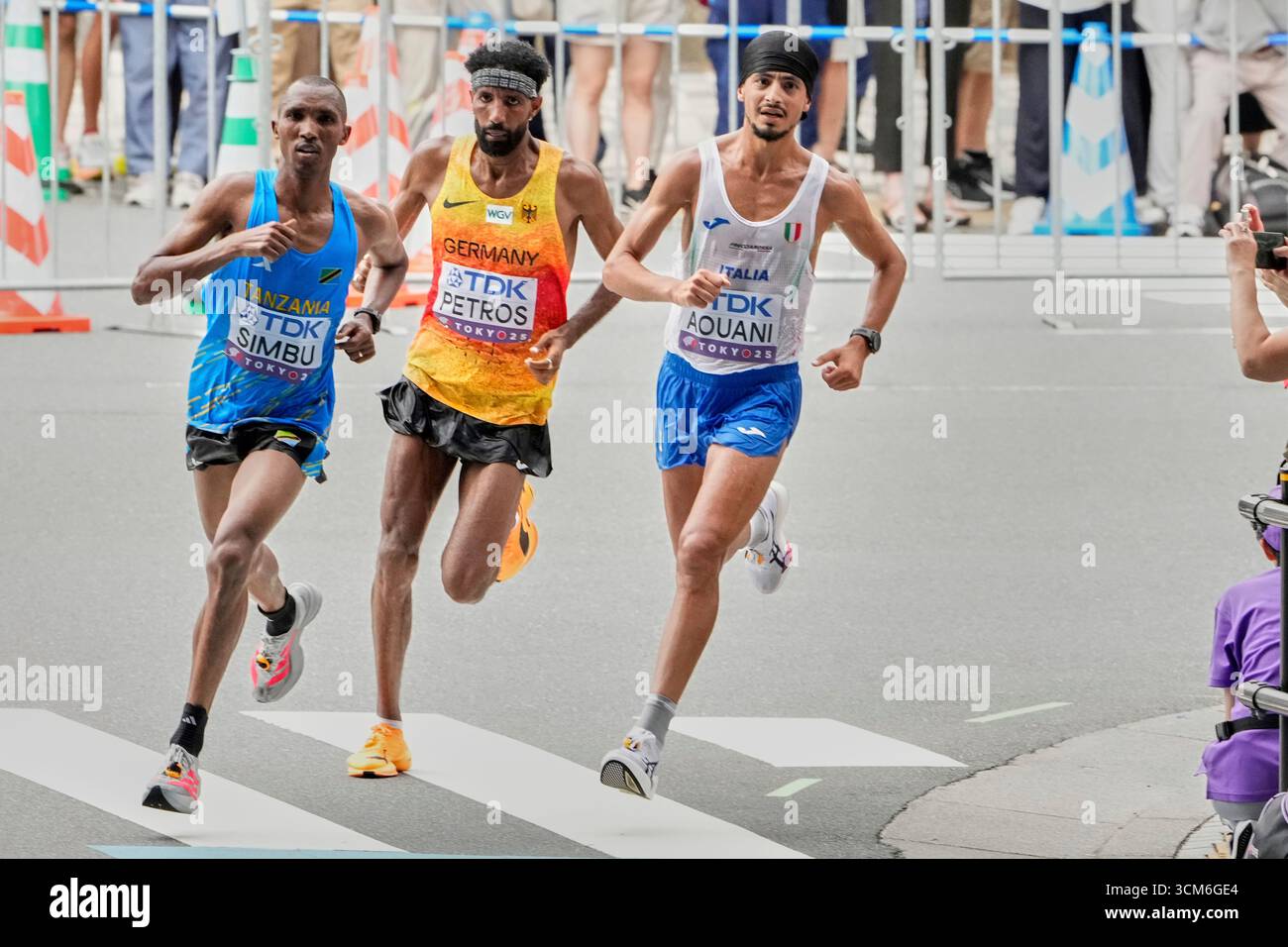 Tanzania's Alphonce Felix Simbu, Germany's Amanal Petros and Italy's ...