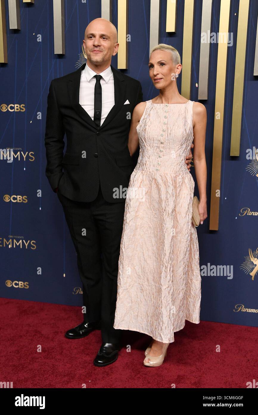 Adam Randall, left, and Natalie Randall arrive at the 77th Primetime ...