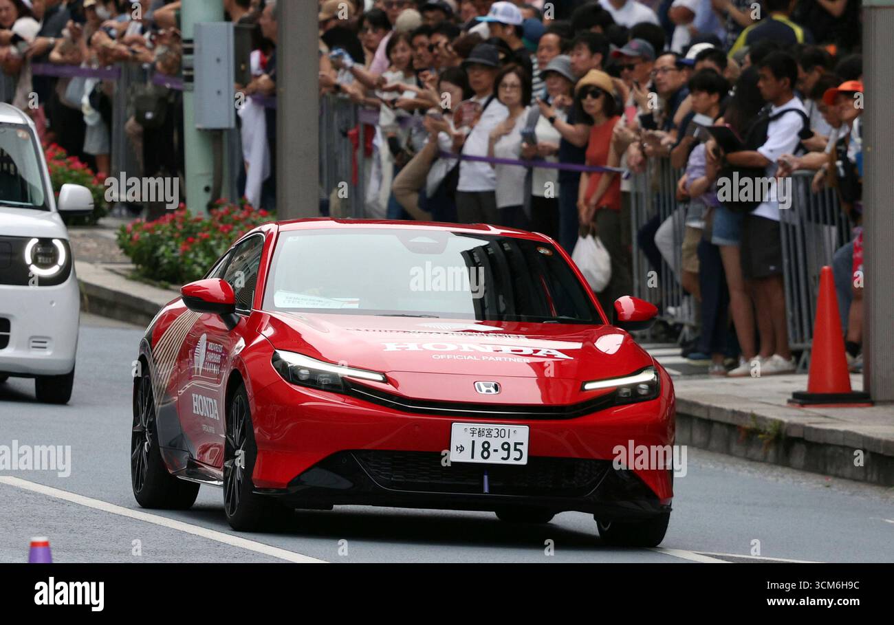 HONDA's new PRELUDE drives the marathon course to check road conditions during the Men's ...
