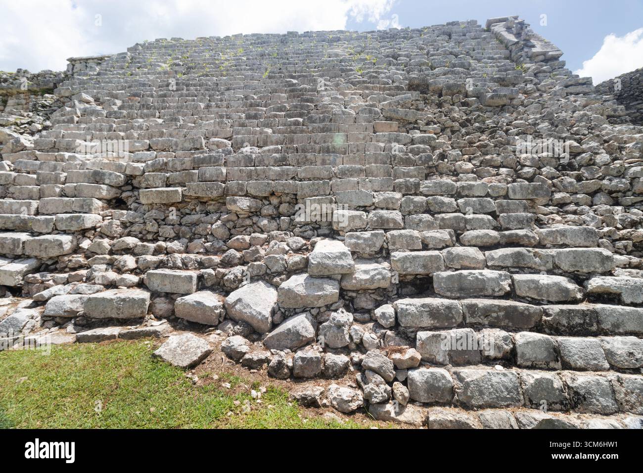 Close up to the details of a mayan temple stairs ruins into Chichen ...