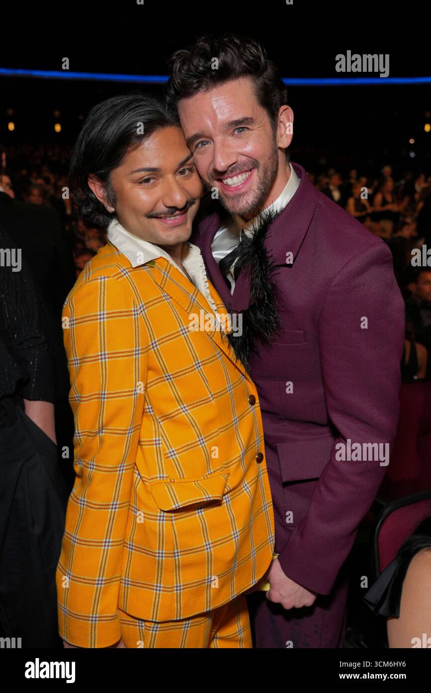Mark Indelicato, left, and Michael Urie attend the 77th Emmy Awards on ...