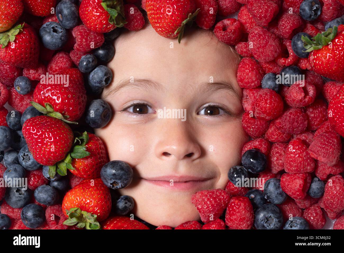 Funny fruits. Berries mix of strawberry, blueberry, raspberry ...