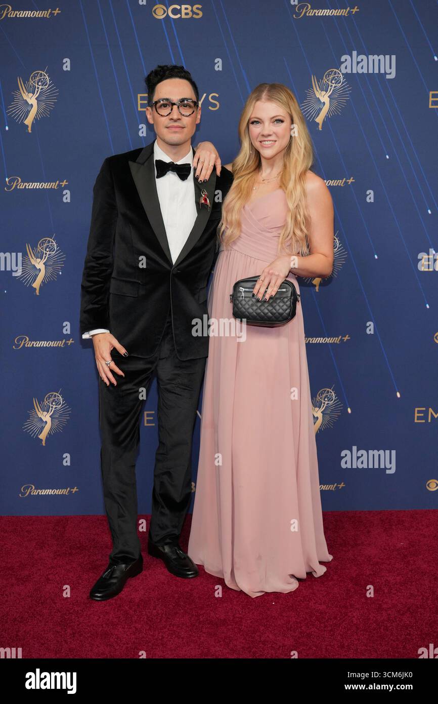 Troy Iwata, left, arrives at the 77th Emmy Awards on Sunday, Sept. 14 ...