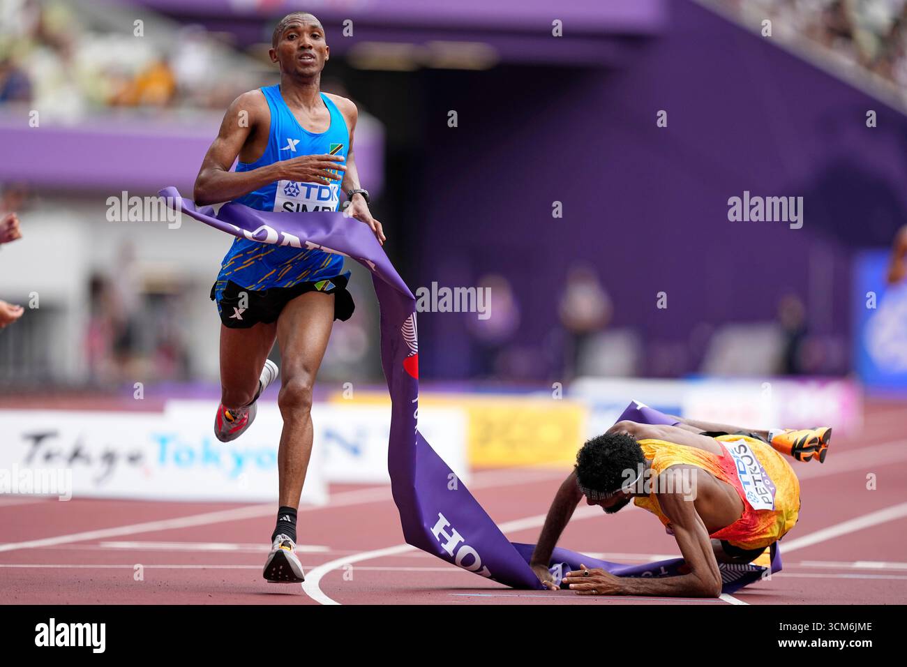 Tanzania's Alphonce Felix Simbu, left, wins the gold in the men's ...