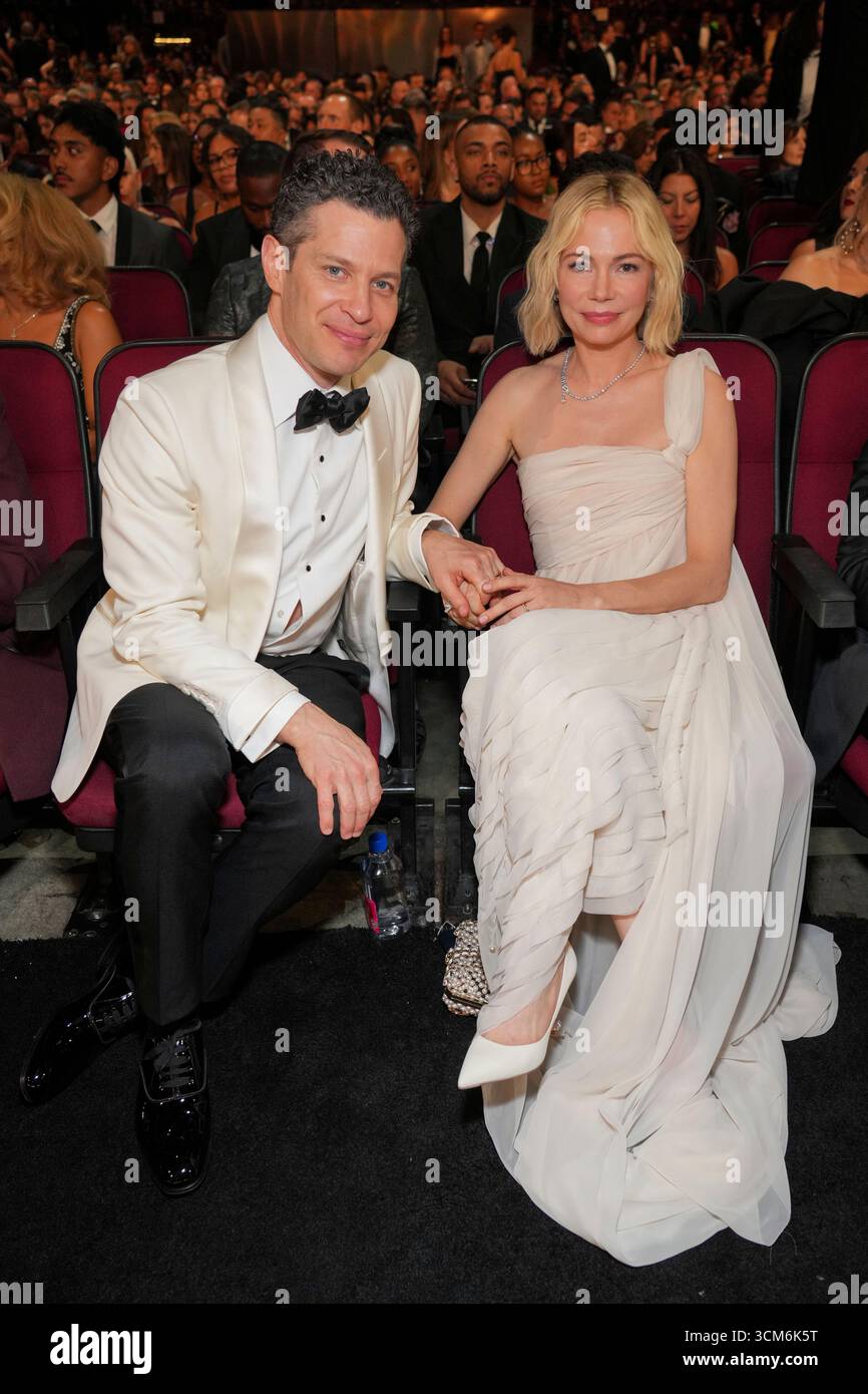 Thomas Kail, left, and Michelle Williams attend the 77th Emmy Awards on ...