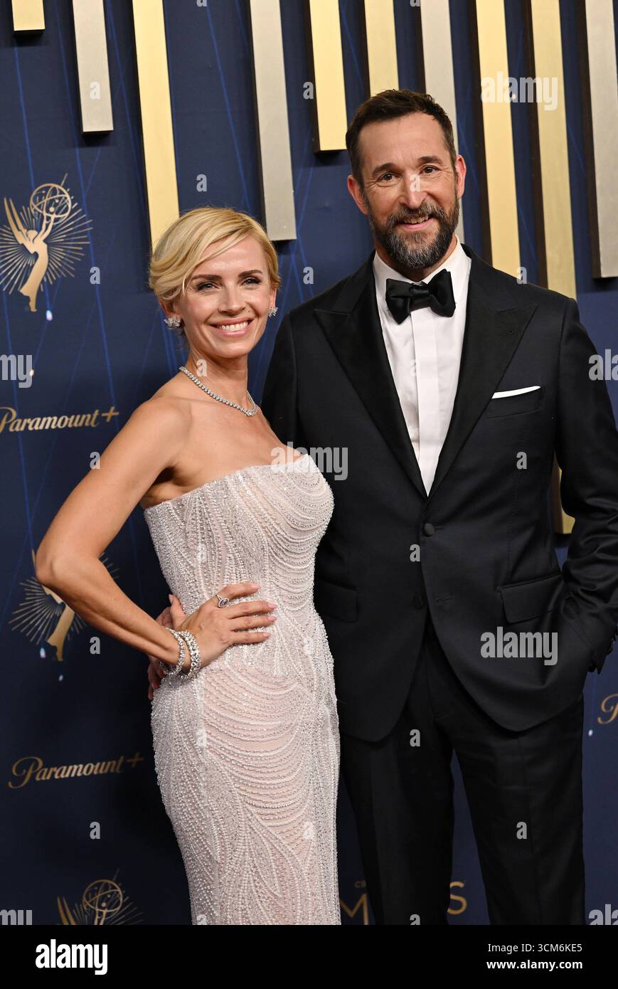 (L-R) Sara Wells and Noah Wyle arrive for the 77th annual Primetime Emmy Awards at the Peacock ...
