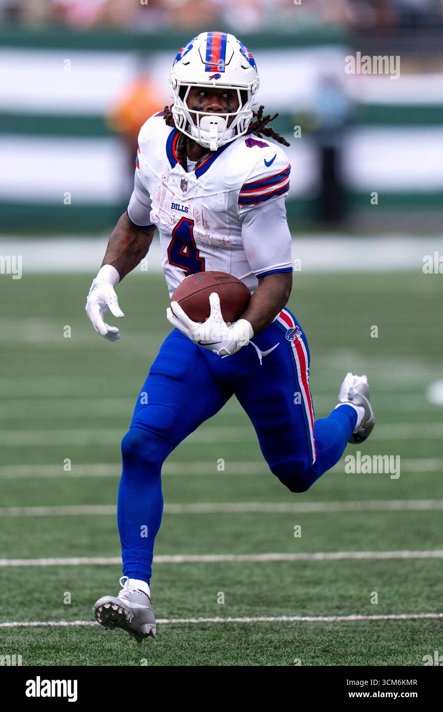 Buffalo Bills running back James Cook (4) runs with the ball for a ...