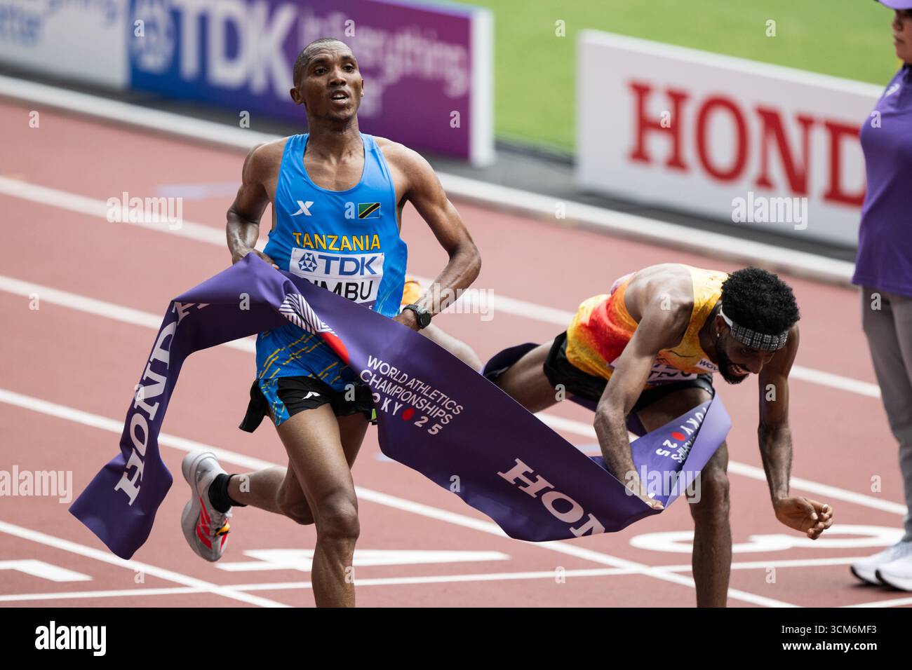 Alphonce Felix Simbu of Tanzania (Left) races Amanal Petros of Germany ...
