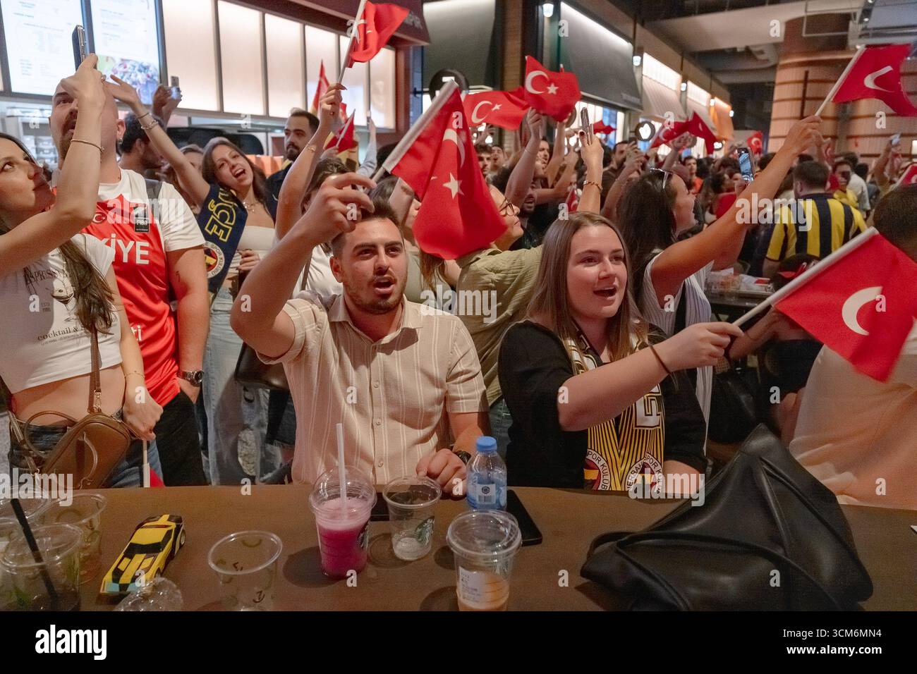 Turkish fans are seen following the match with great enthusiasm. The ...