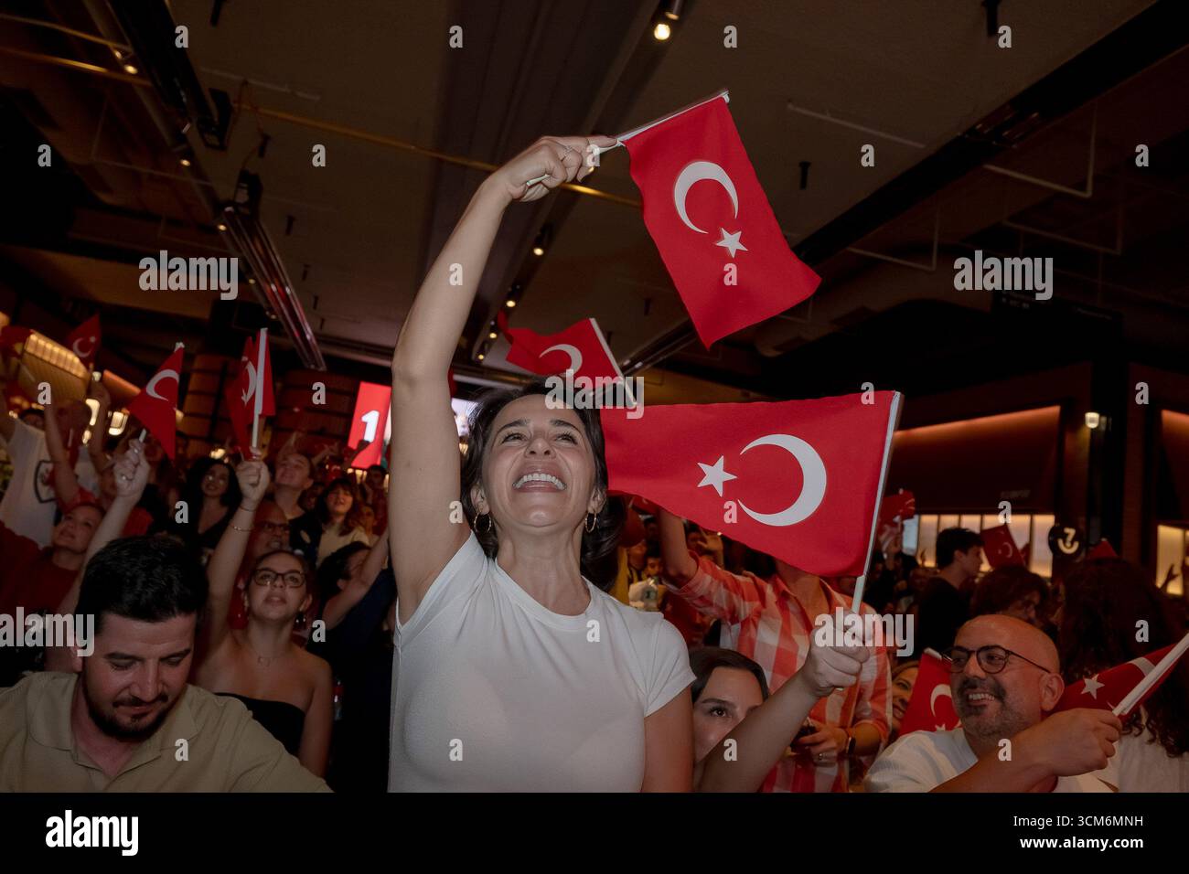 Turkish fans are seen following the match with great enthusiasm. The ...