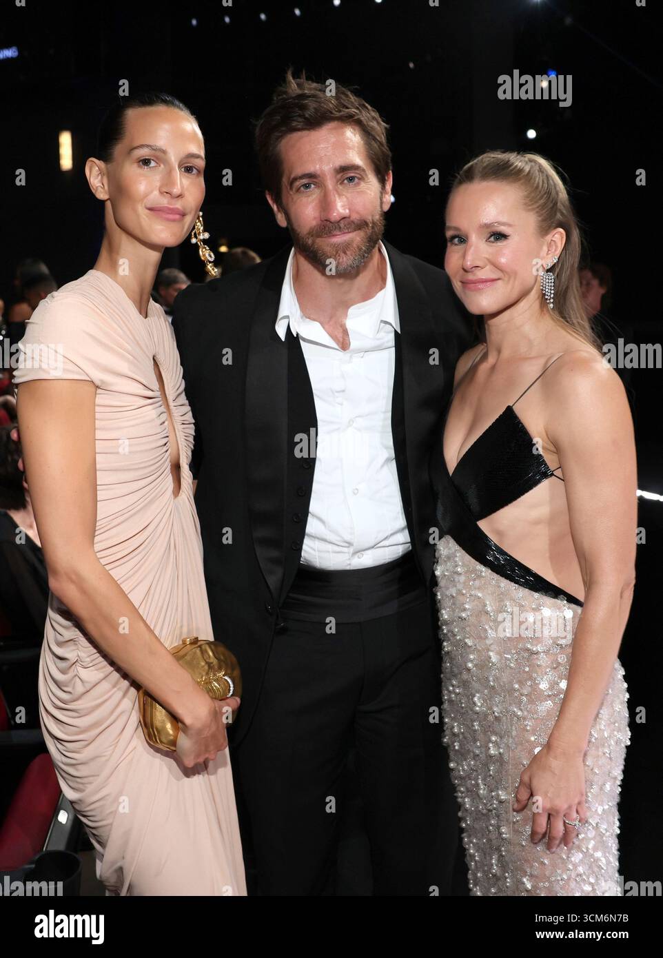 Jeanne Cadieu, Jake Gyllenhaal and Kristen Bell at the 77th Emmy Awards ...