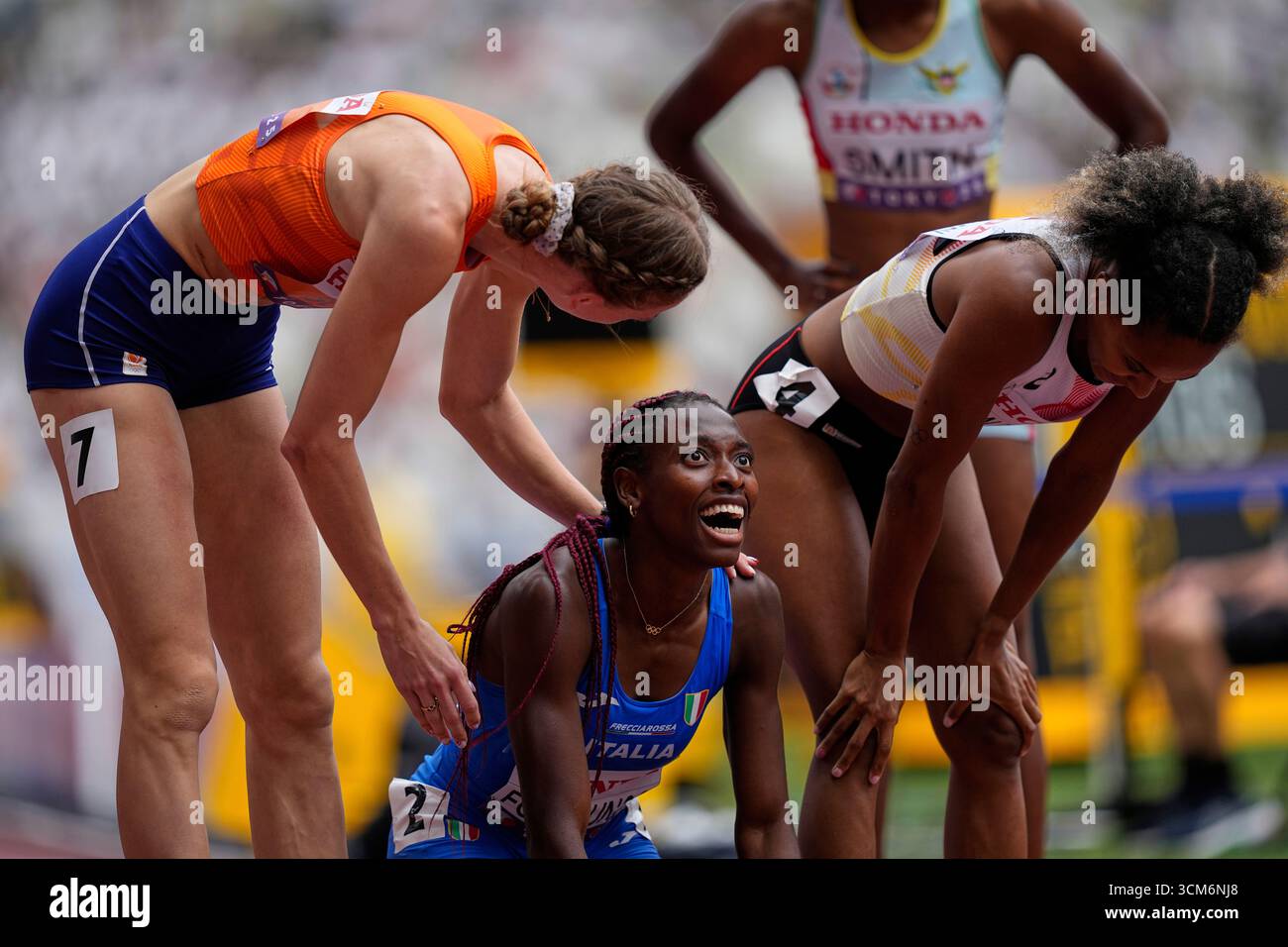 Italy's Ayomide Folorunso reacts after finishing a women's 400 meters ...