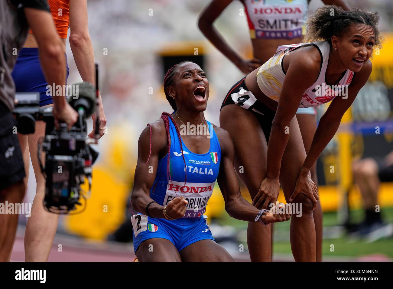 Italy's Ayomide Folorunso reacts after finishing a women's 400 meters ...