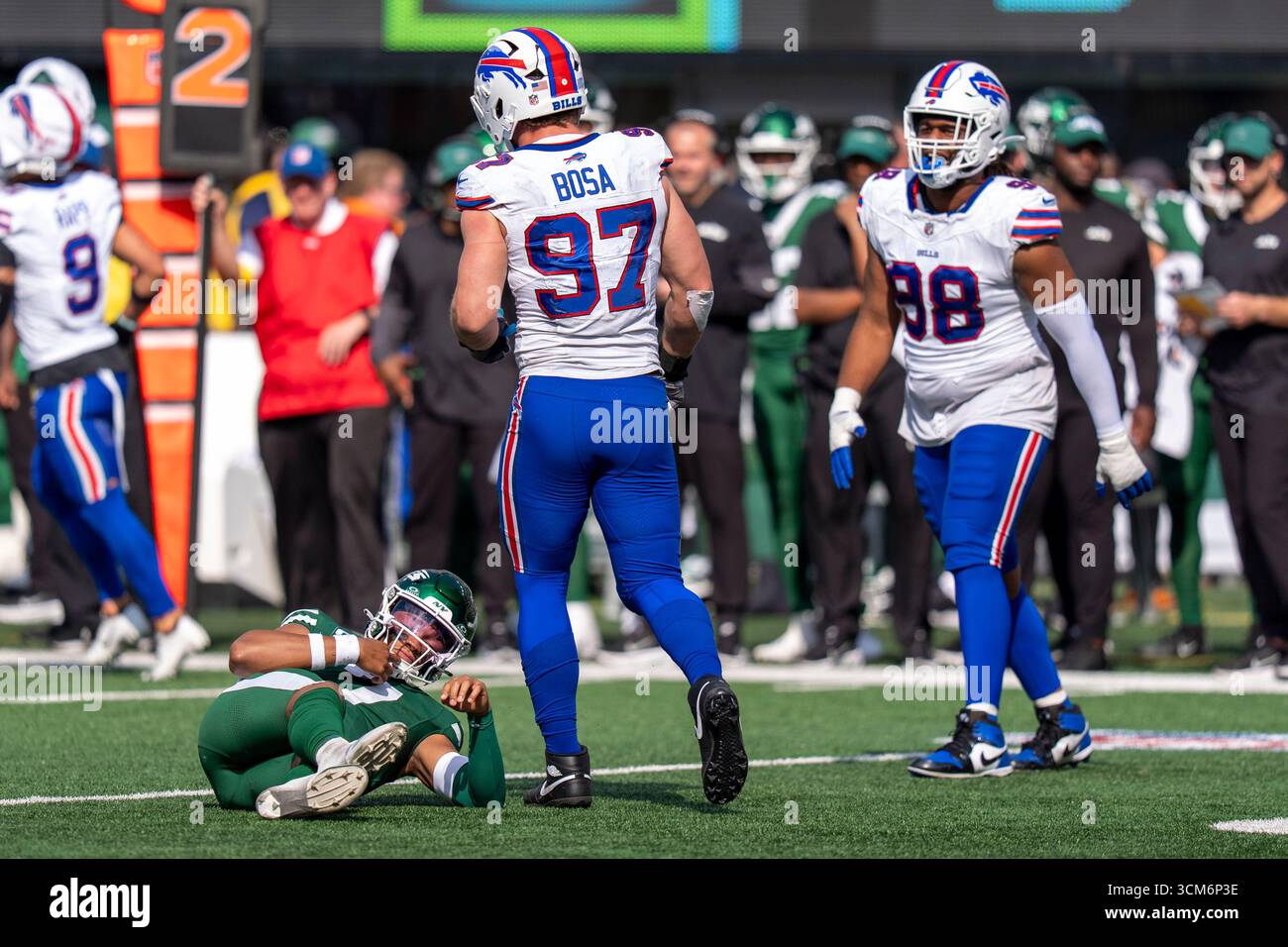 New York Jets quarterback Justin Fields (7) looks on after getting hit ...