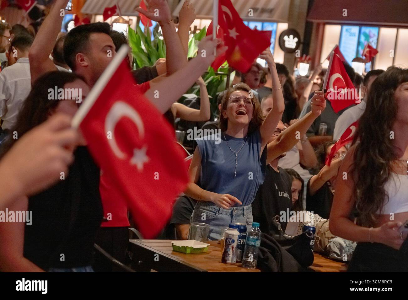 Turkish fans are seen following the match with great enthusiasm. The ...