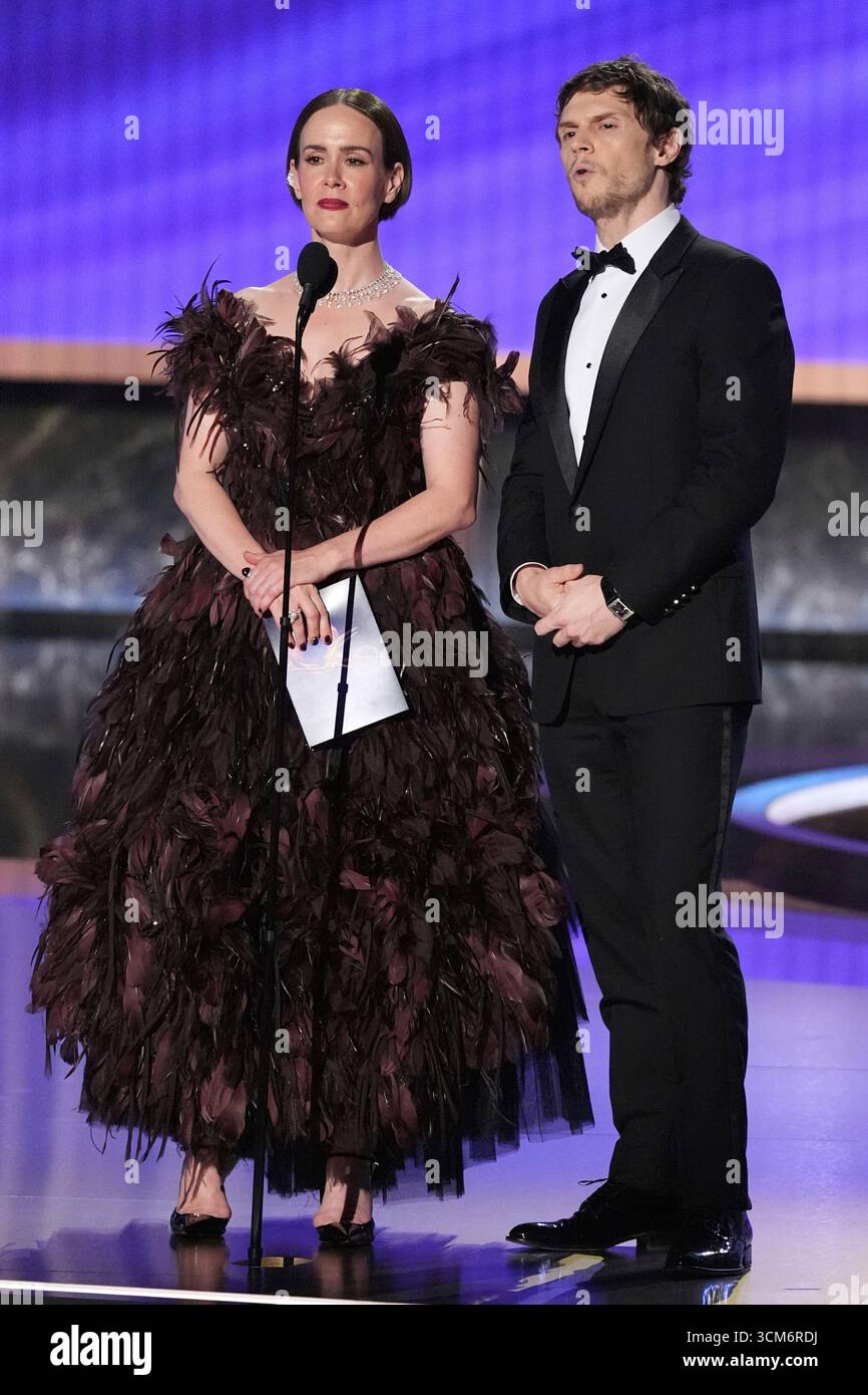 Sarah Paulson, left, and Evan Peters present the award for outstanding ...