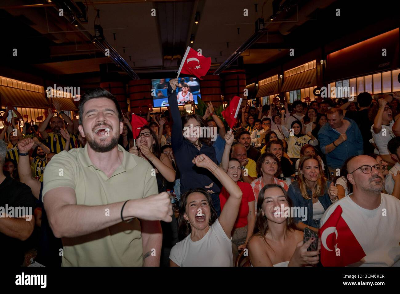 Turkish fans are seen following the match with great enthusiasm. The ...