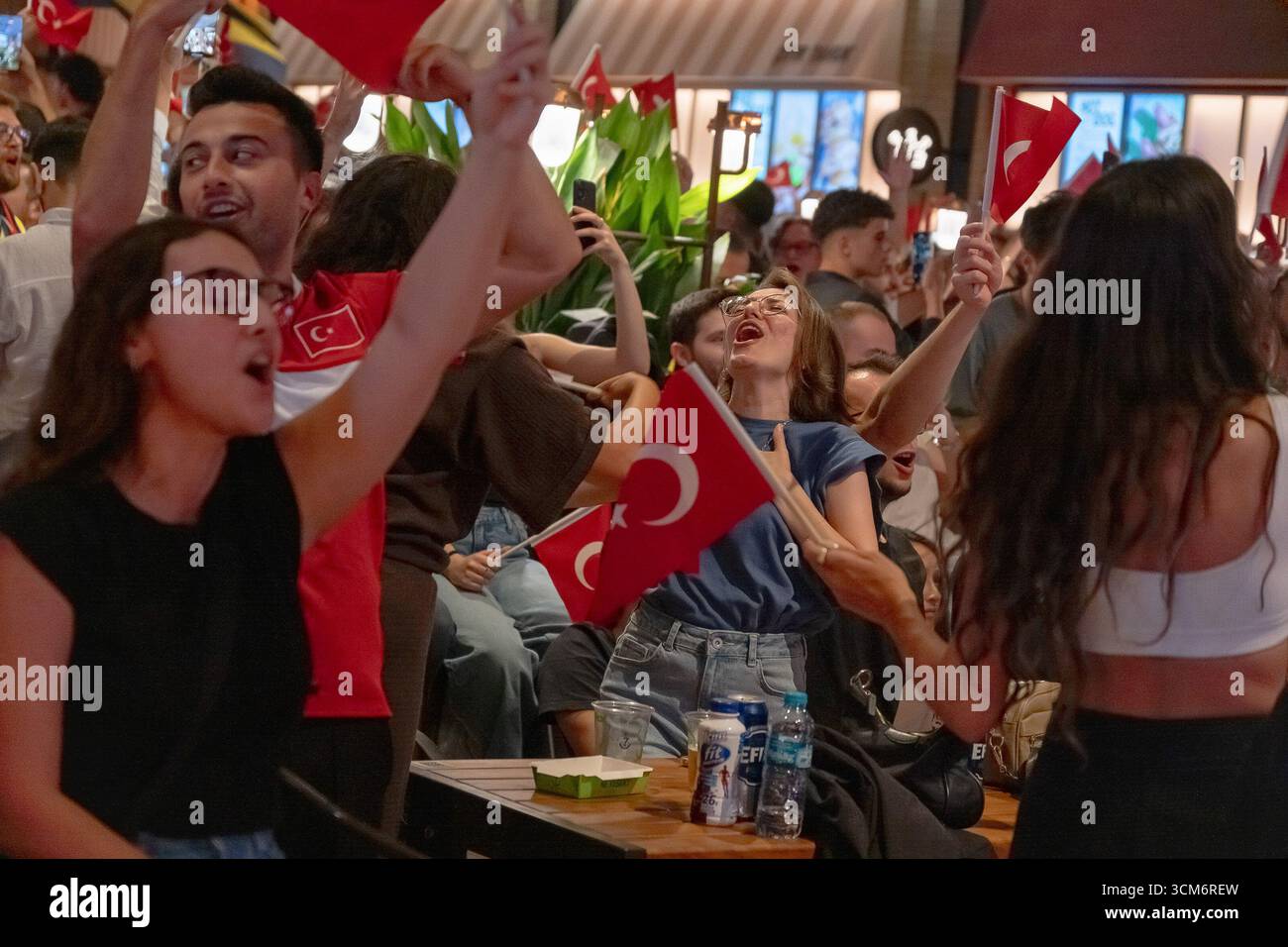 Turkish fans are seen following the match with great enthusiasm. The ...