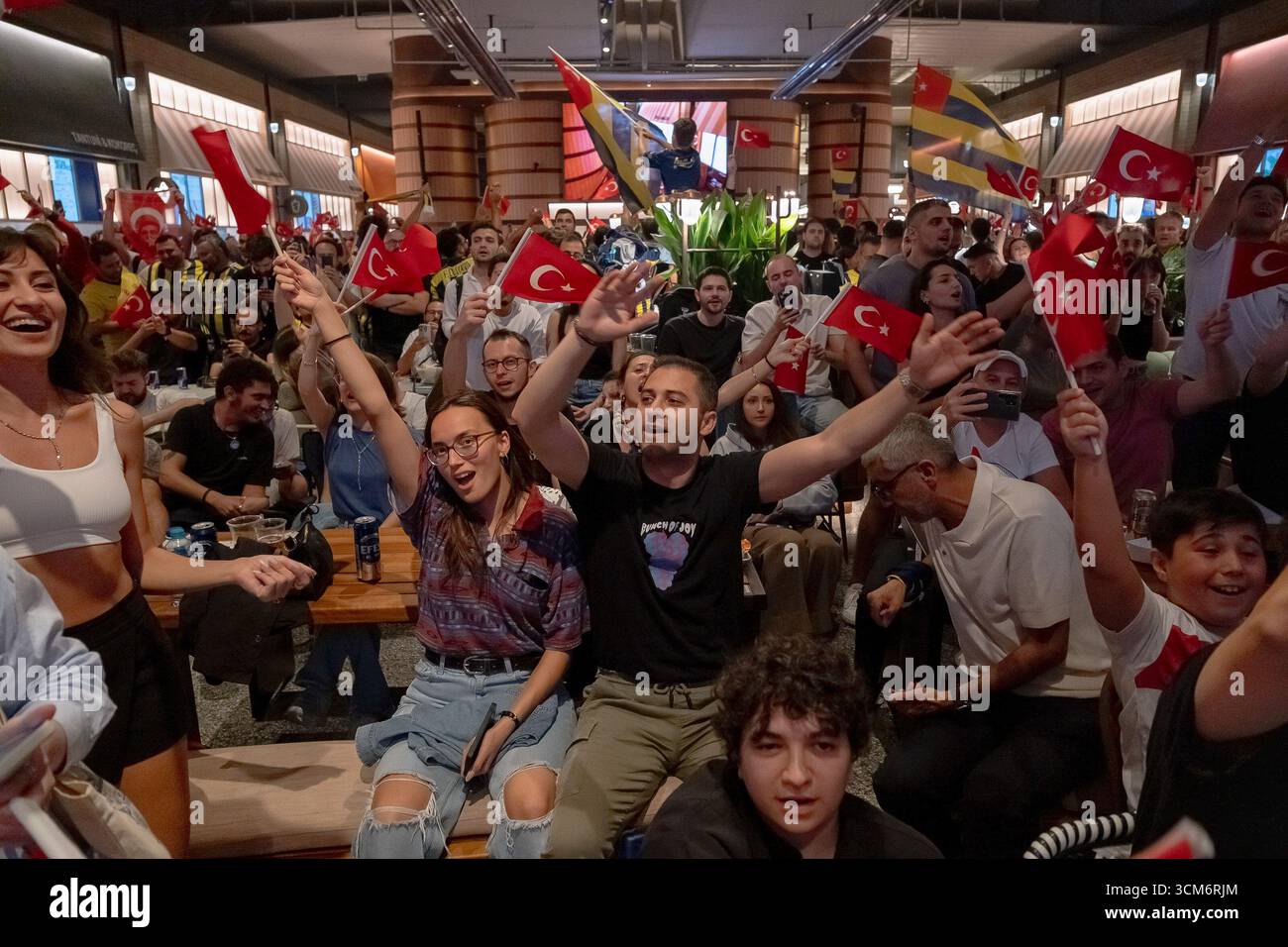 Turkish fans are seen following the match with great enthusiasm. The ...