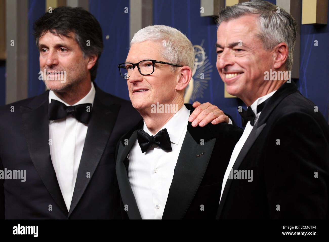 James Erlicht, from left, Tim Cook and Eddie Cue arrive at the 77th ...
