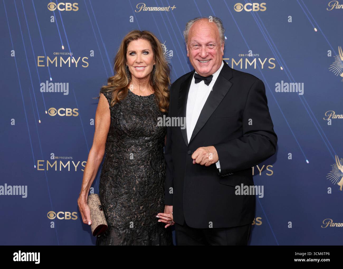 Diane Wilk, left, and Douglas Urbanski arrive at the 77th Emmy Awards ...