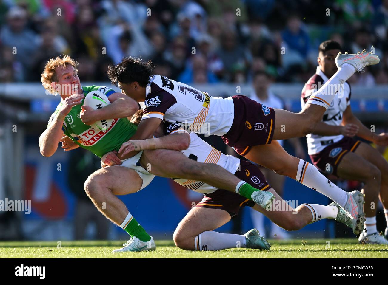 Zac Hosking of the Raiders is tackled during the NRL Qualifying Final ...