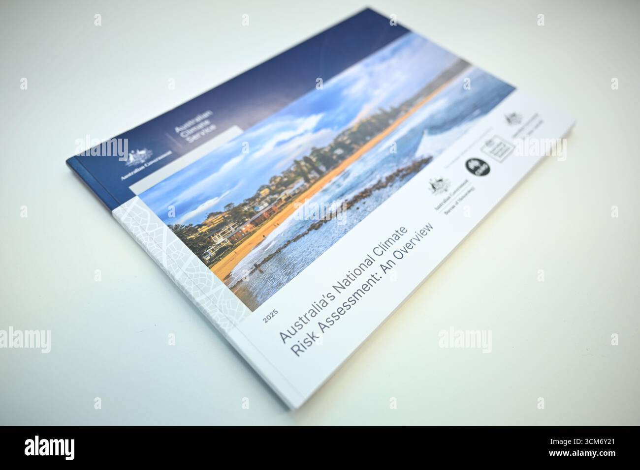 A copy of Australia’s National Climate Risk Assessment is seen at ...