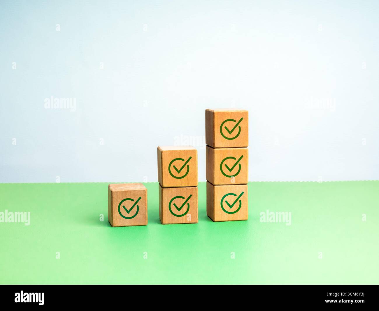 Green business growth concept with wooden cube blocks stacked upward ...