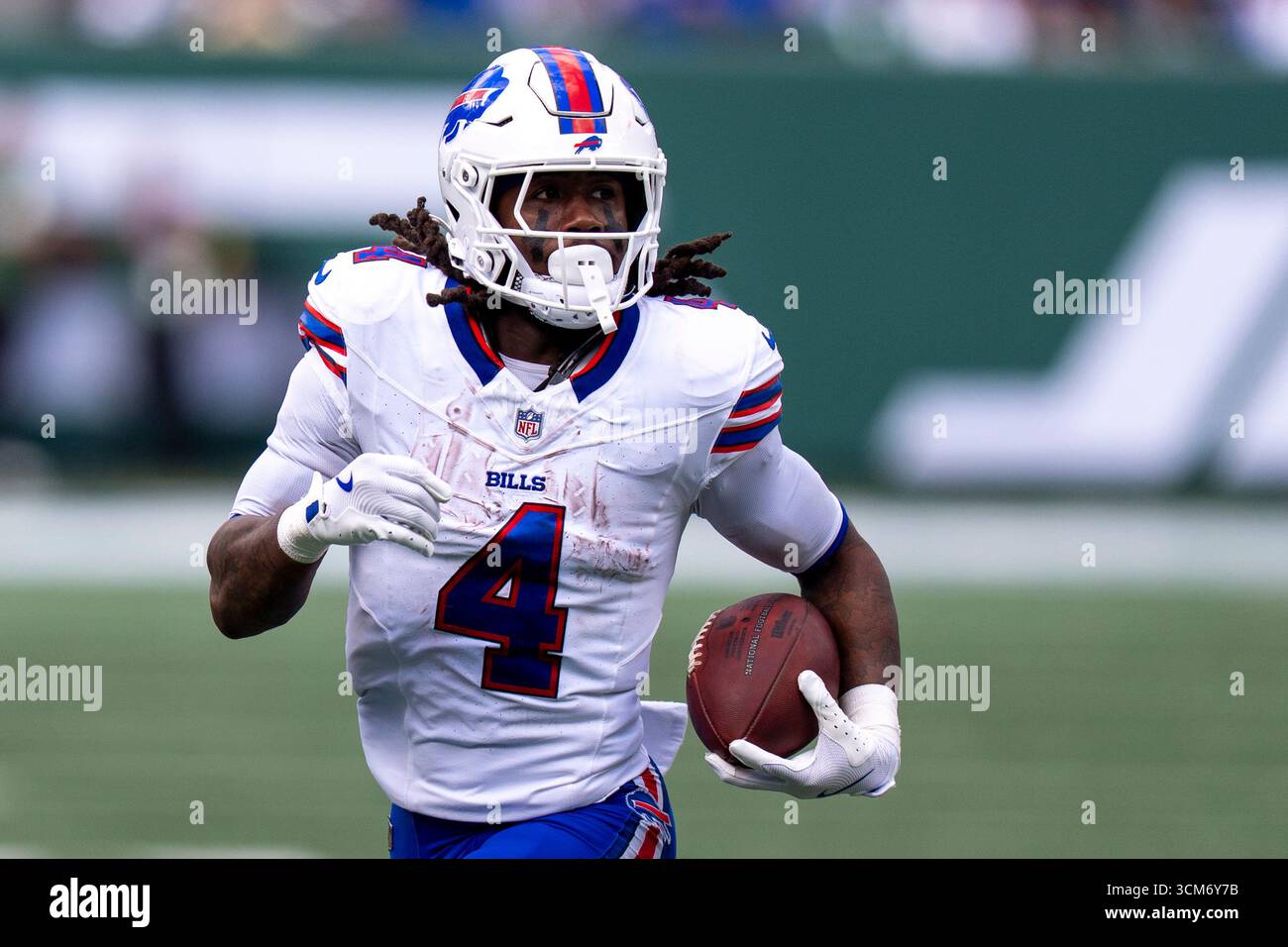 Buffalo Bills running back James Cook (4) runs with the ball for a ...