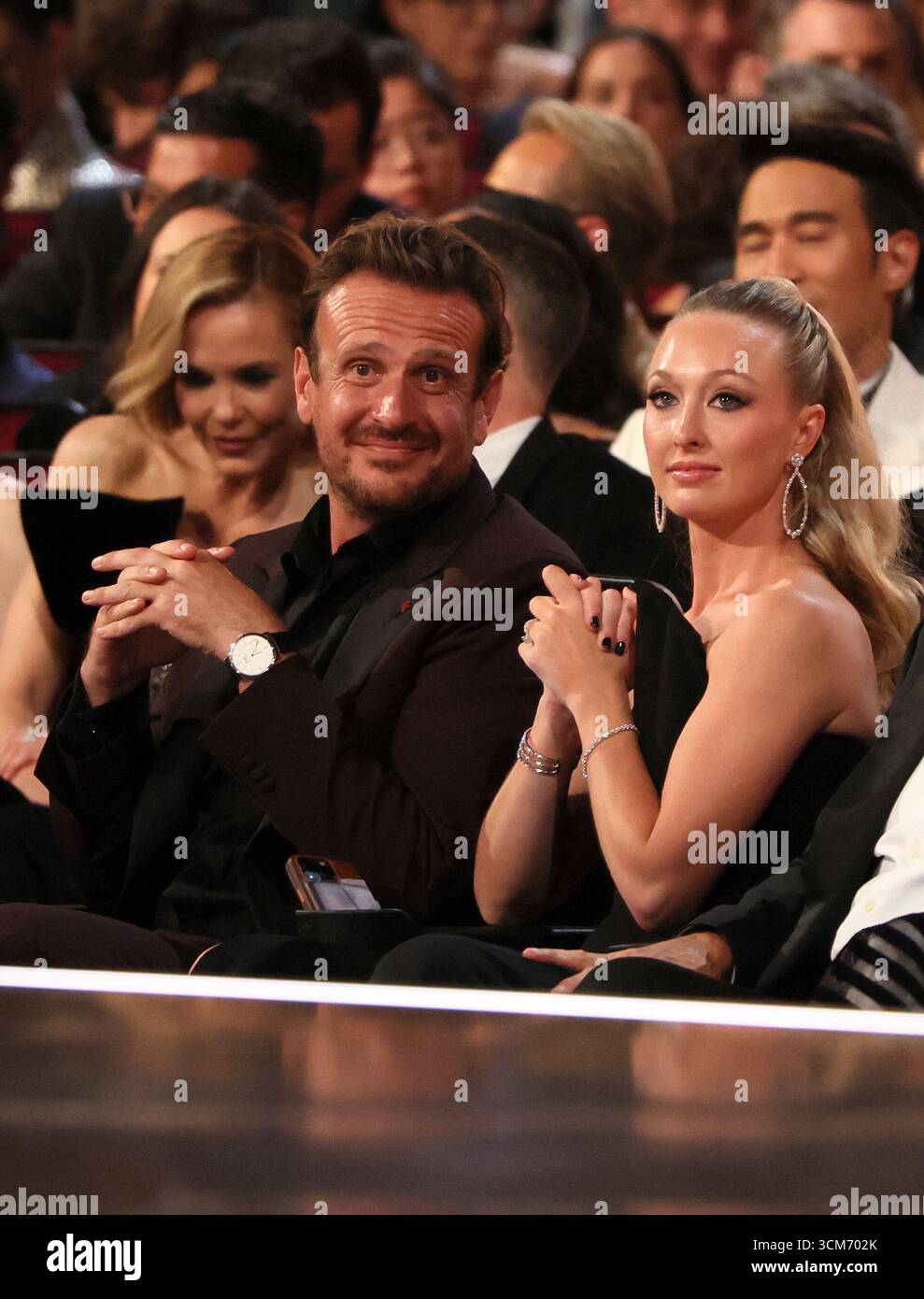 Jason Segel, left, and Kayla Radomski at the 77th Emmy Awards on Sunday ...