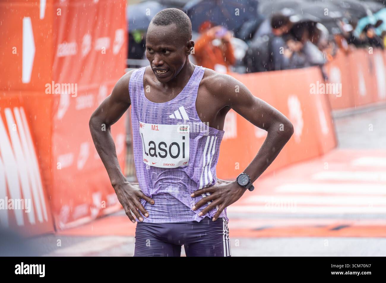 Third place winner Isaia Lasoi of Kenya crosses the finishing line ...