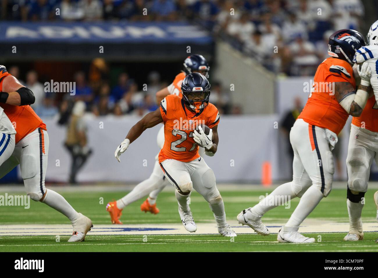 Denver Broncos running back J.K. Dobbins (27) runs the ball during an NFL football game against ...