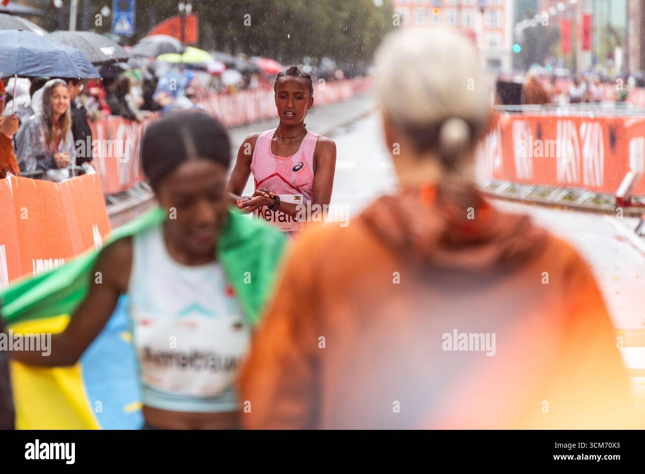 The third female athlete Wede Kefale of Ethiopia crosses the finishing ...