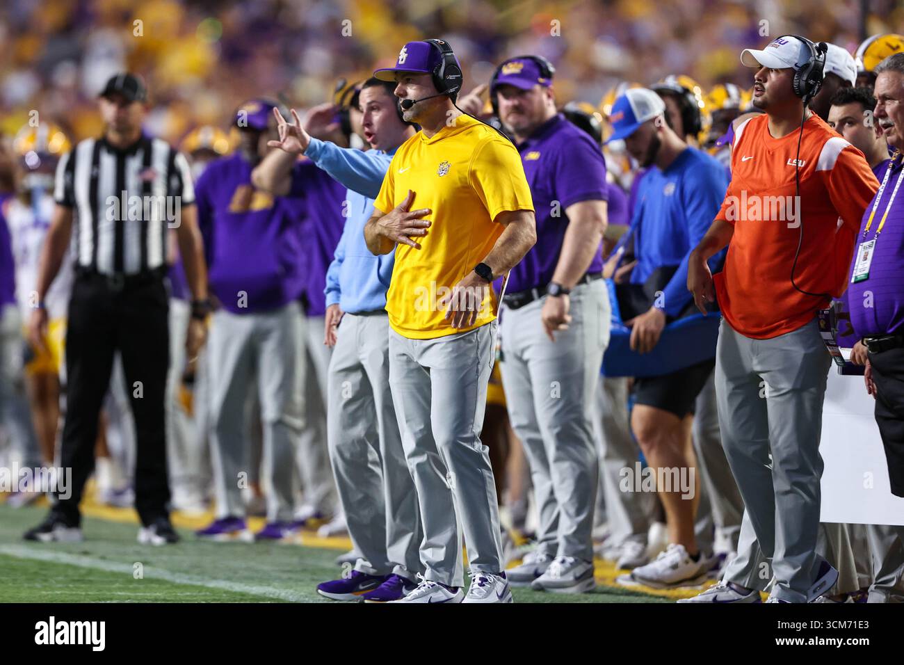 September 13, 2025: LSU defensive coordinator Blake Baker signals in a ...