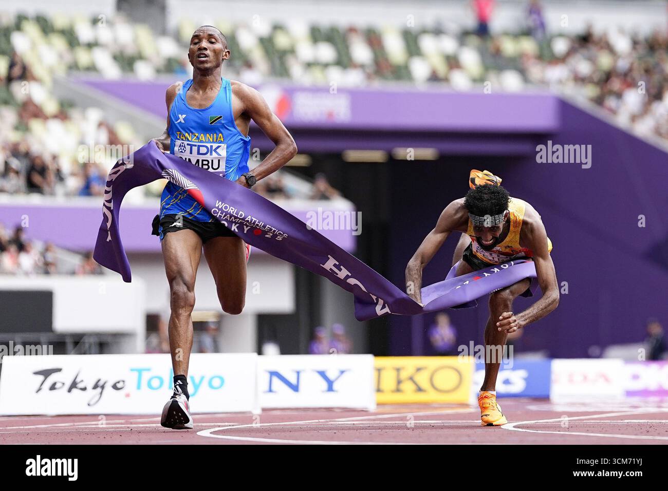 Alphonce Felix Simbu (L) of Tanzania, followed by Amanal Petros of ...