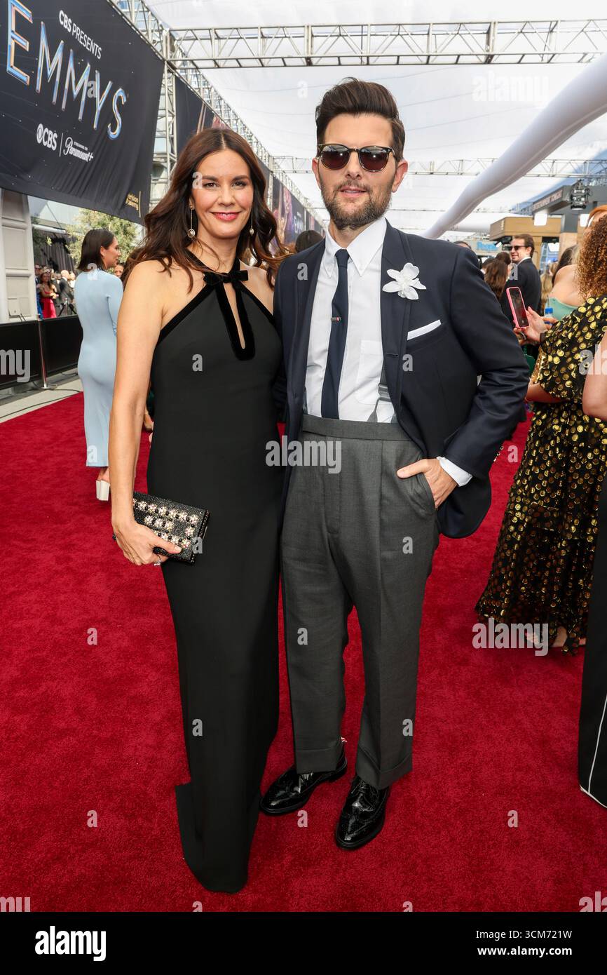 Naomi Scott and Adam Scott walk the red carpet at the 77th Emmy Awards on Sunday, Sept. 14, 2025 ...