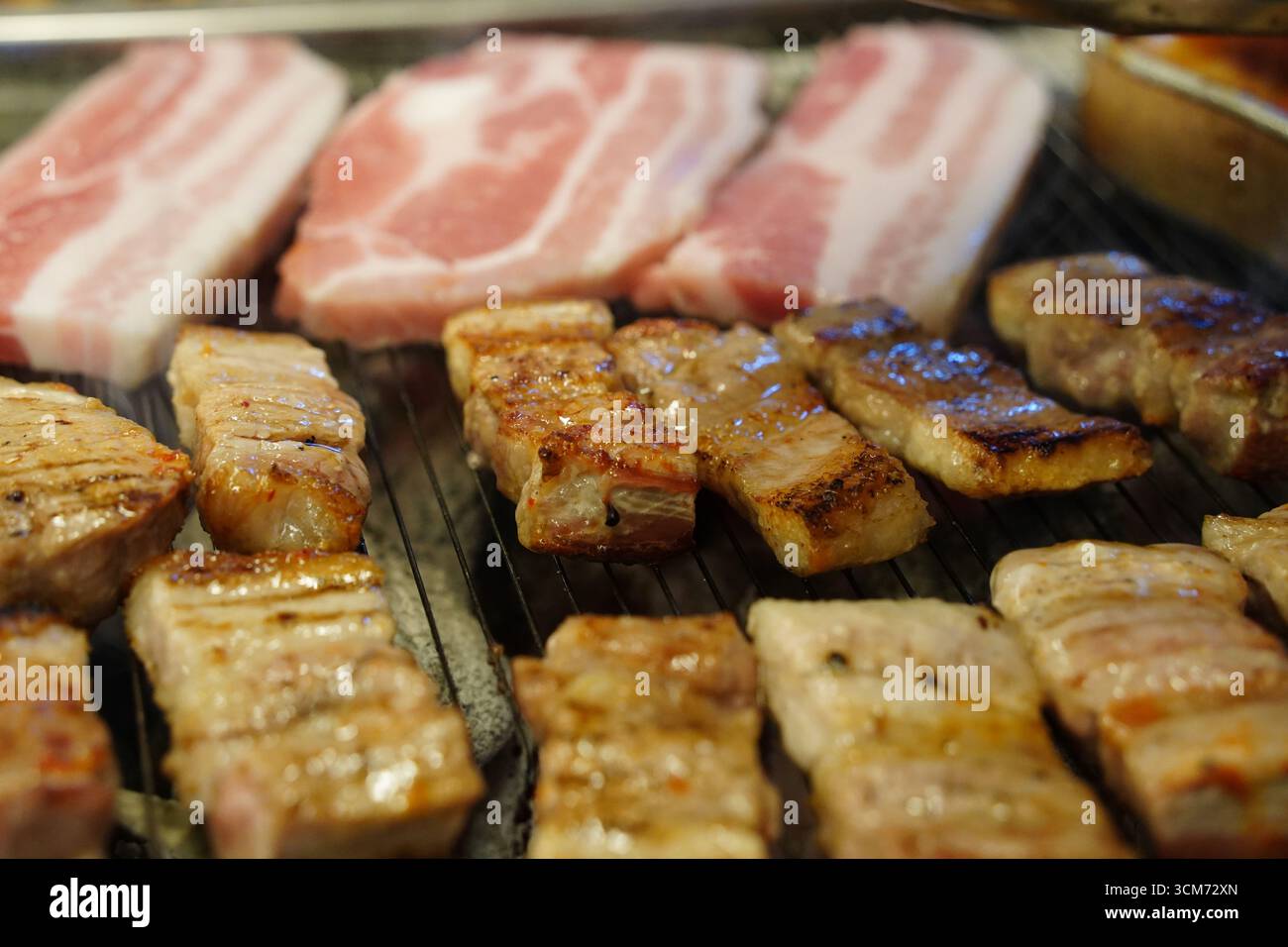 Korean Samgyeopsal (Pork Belly) Grilling on Hot Plate Stock Photo - Alamy