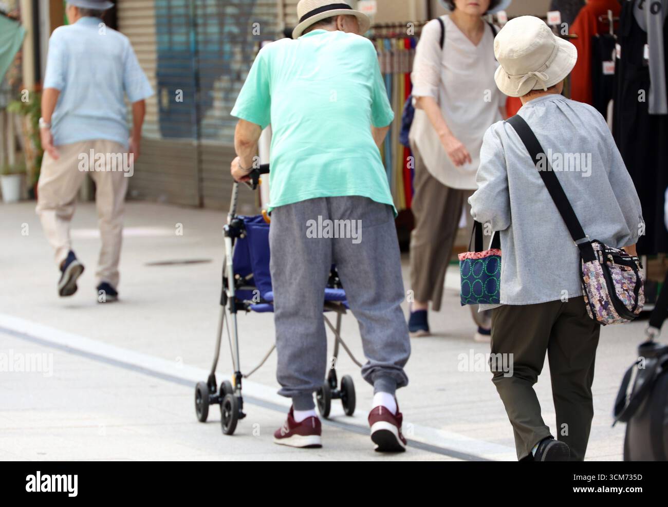 Tokyo, Japan. 15th Sep, 2025. An elderly man pushes a senior trolley as ...