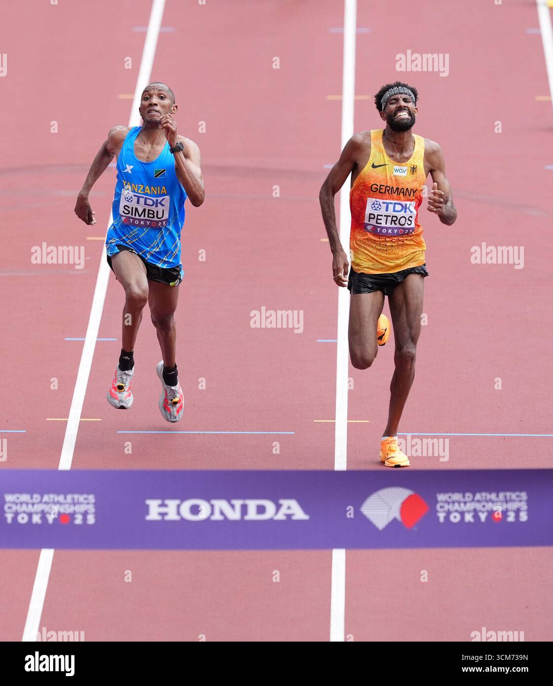 Tanzania's Alphonce Felix Simbu (left) wins the Men's Marathon after a ...
