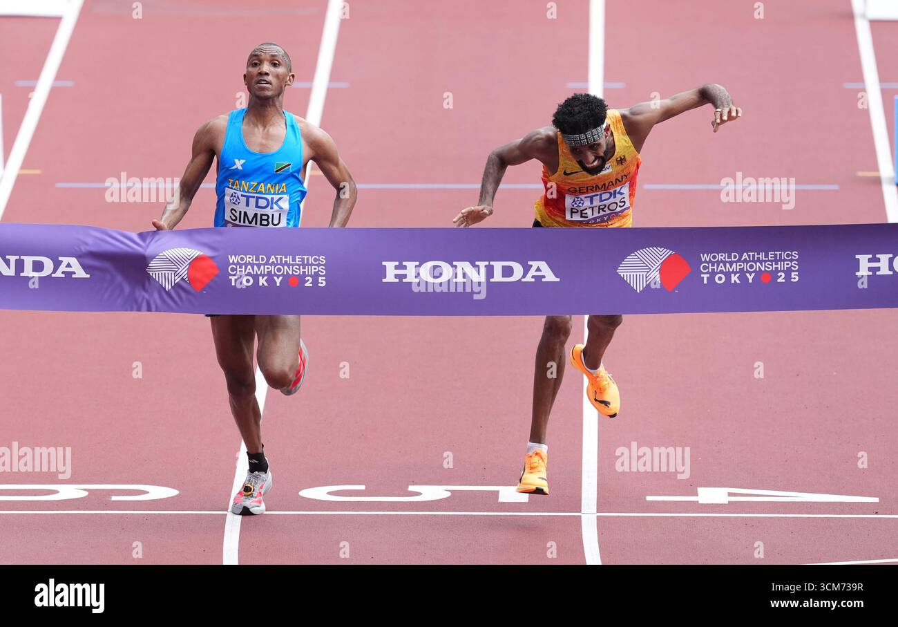Tanzania's Alphonce Felix Simbu (left) wins the Men's Marathon after a ...