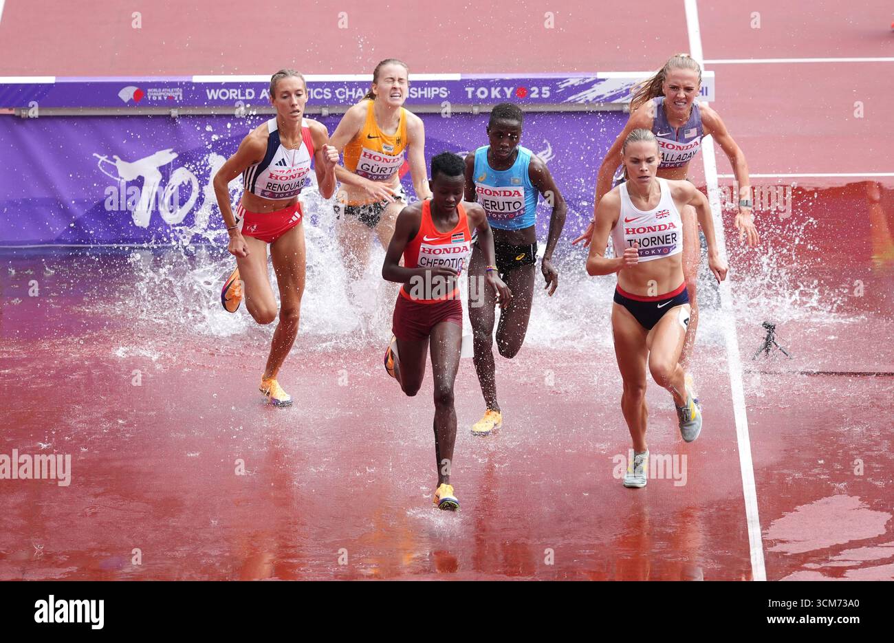 Great Britain's Elise Thorner (right) exits the water jump on her way ...