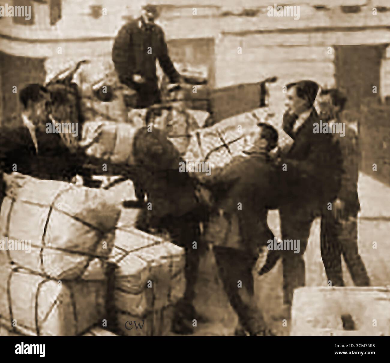 A press photo showing men handling bundles of votes at the 1922 General ...