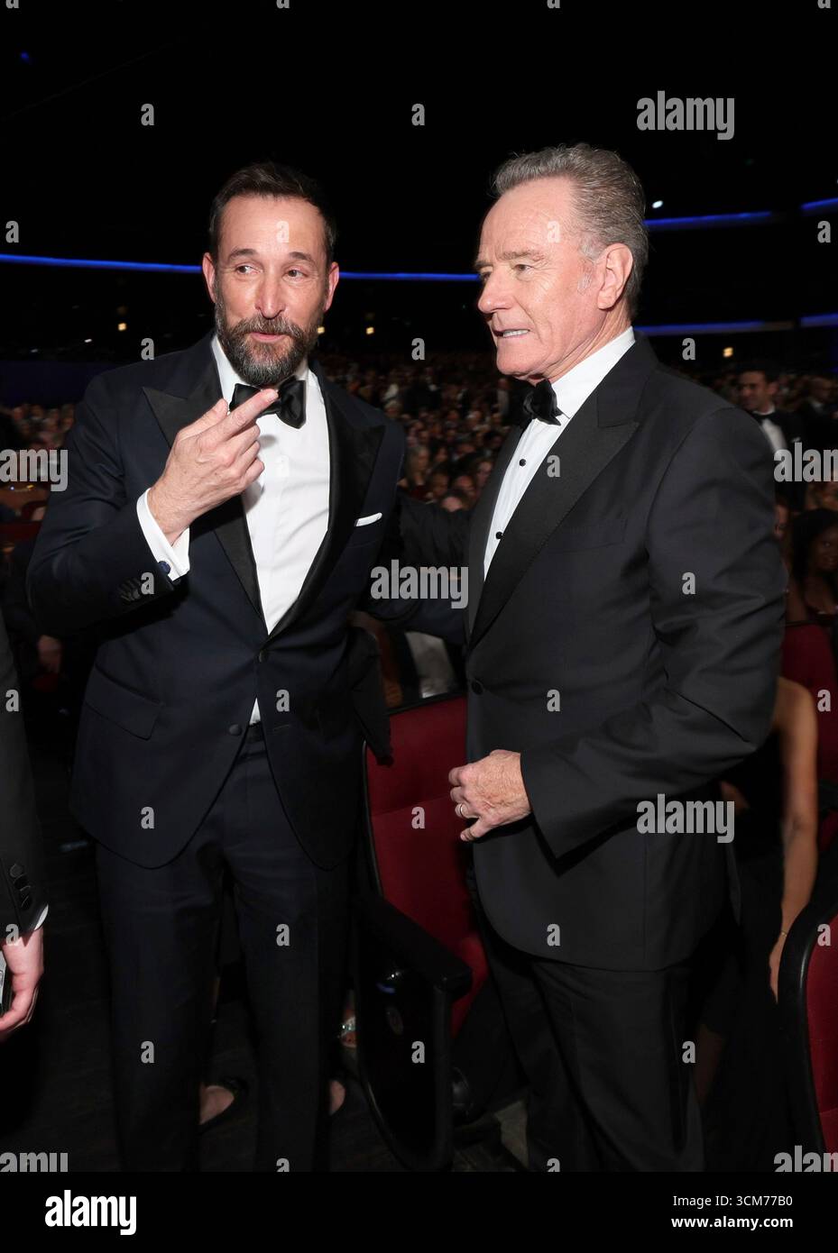 Noah Wyles, left, and Bryan Cranston at the 77th Emmy Awards on Sunday ...