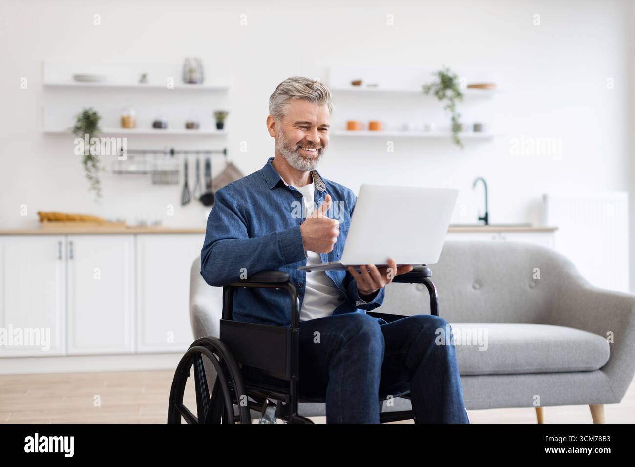 Male wheelchair user setting hi-res stock photography and images - Alamy