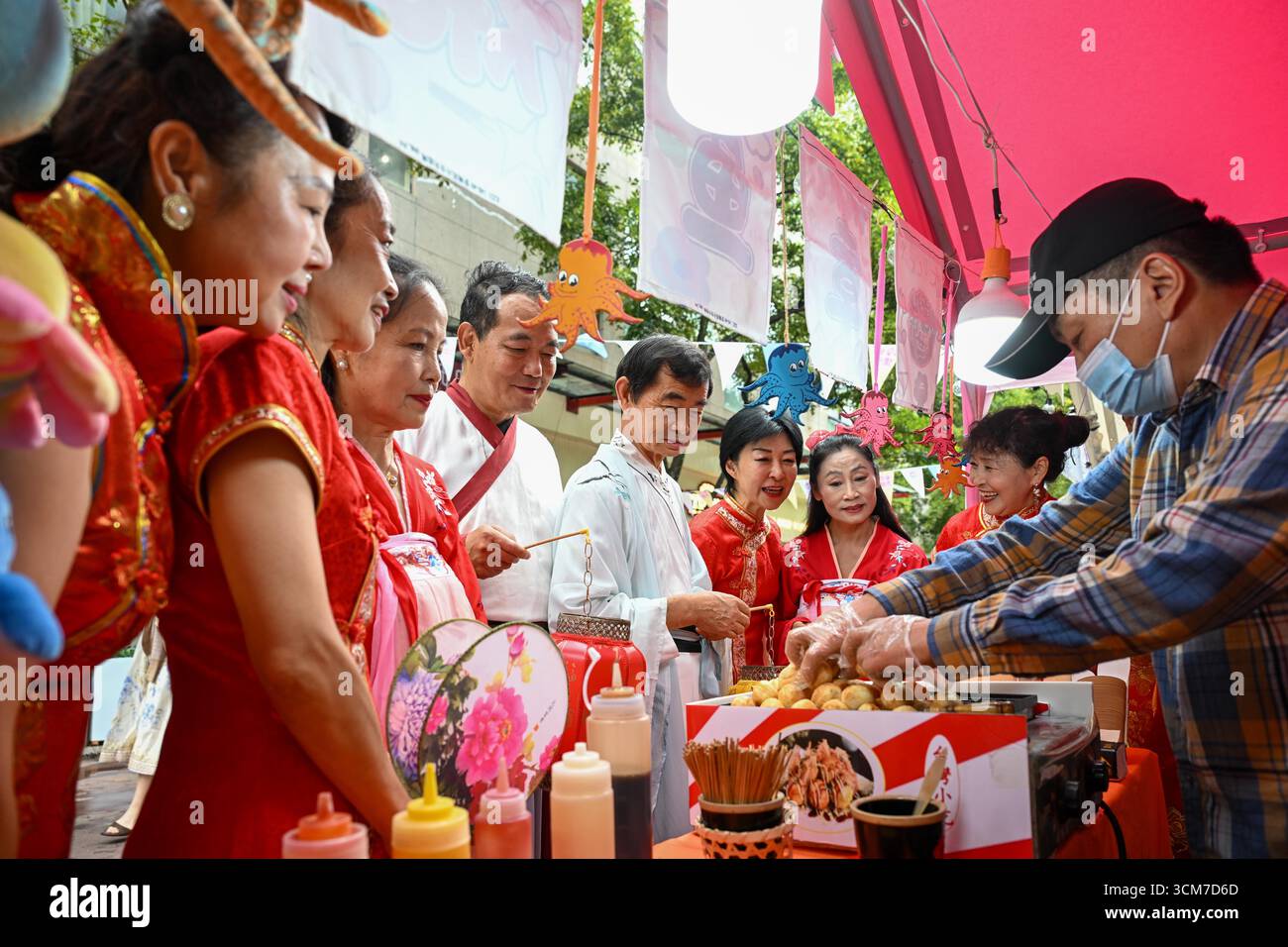 **CHINESE MAINLAND, HONG KONG, MACAU AND TAIWAN OUT** People taste ...